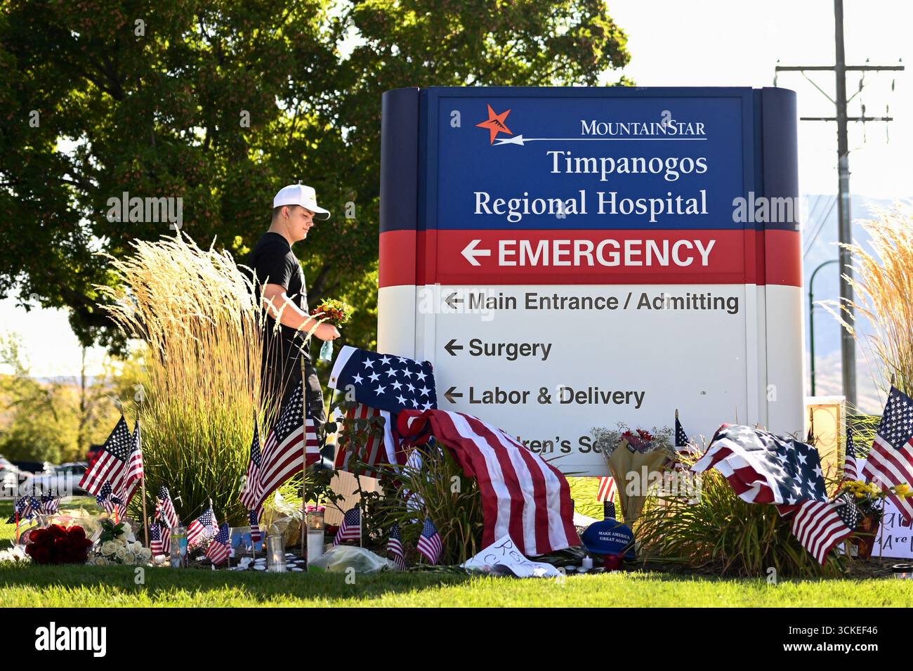 People visit a memorial for Charlie Kirk, the CEO and co-founder of ...