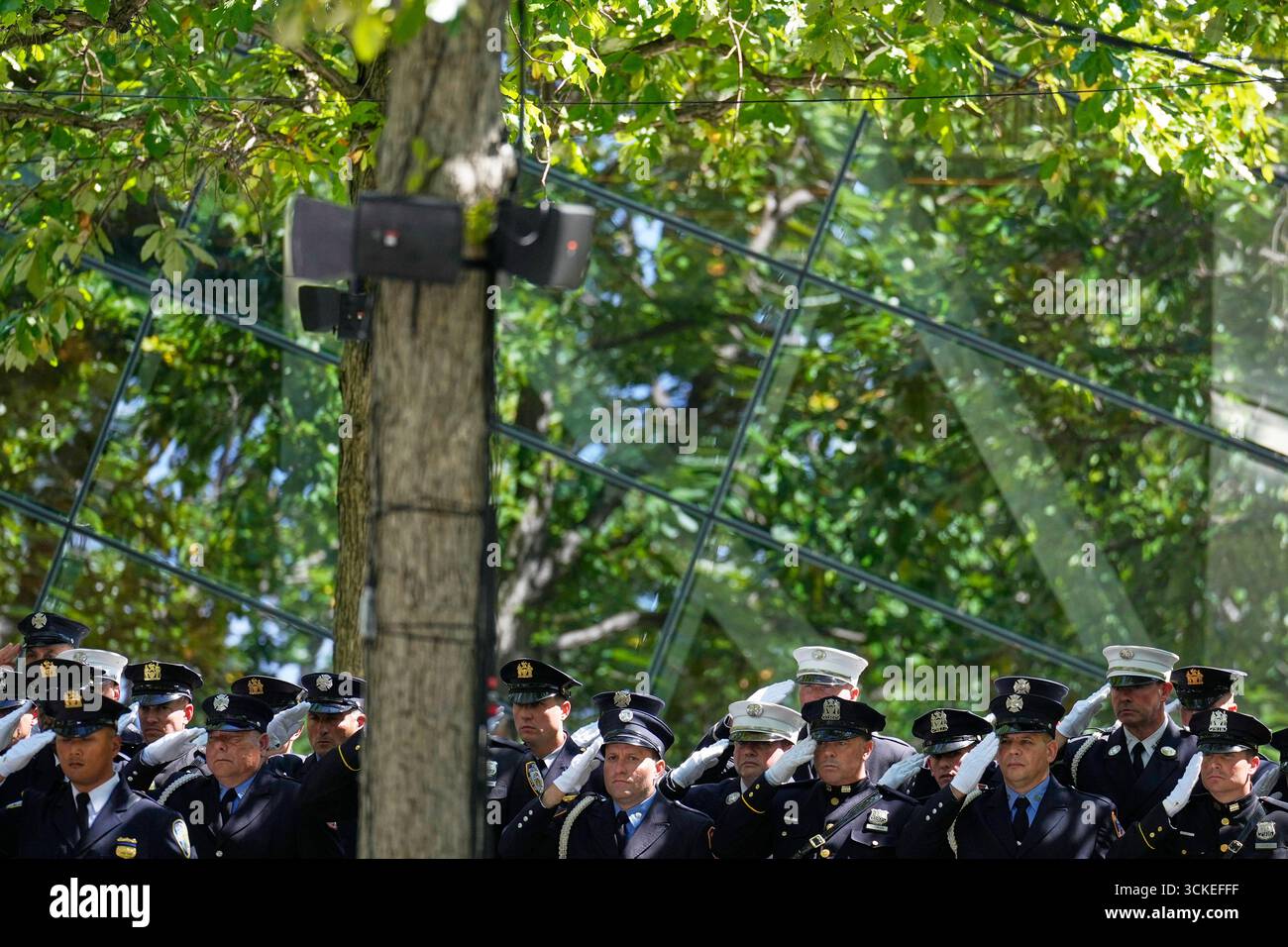 First reporters salute at the end of a ceremony to mark the 24th ...