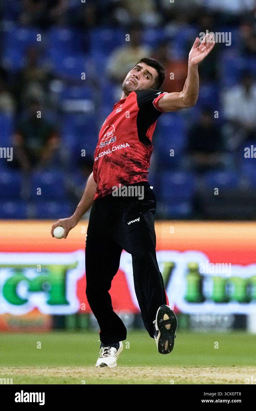 Hong Kong's Aizaz Khan bowls a delivery during the Asia Cup Cricket match between Bangladesh and ...
