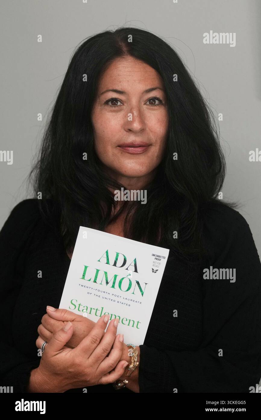 Ada Limón, 24th Poet Laureate of the United States, poses with a copy ...
