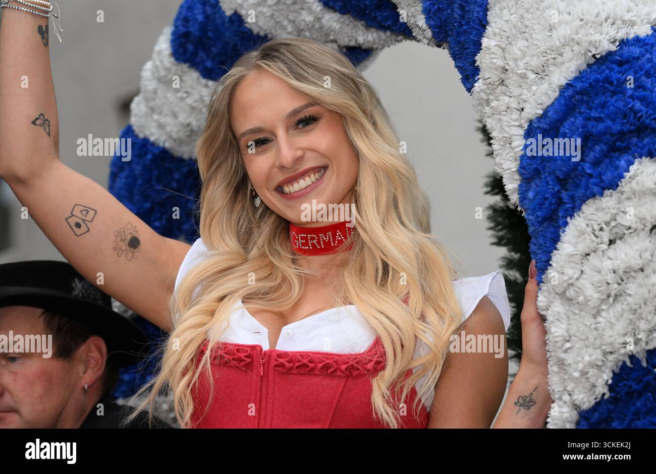 Munich, Germany. 11th Sep, 2025. Leonie Splitter, the Oktoberfest Playmate 2025, stands on the ...
