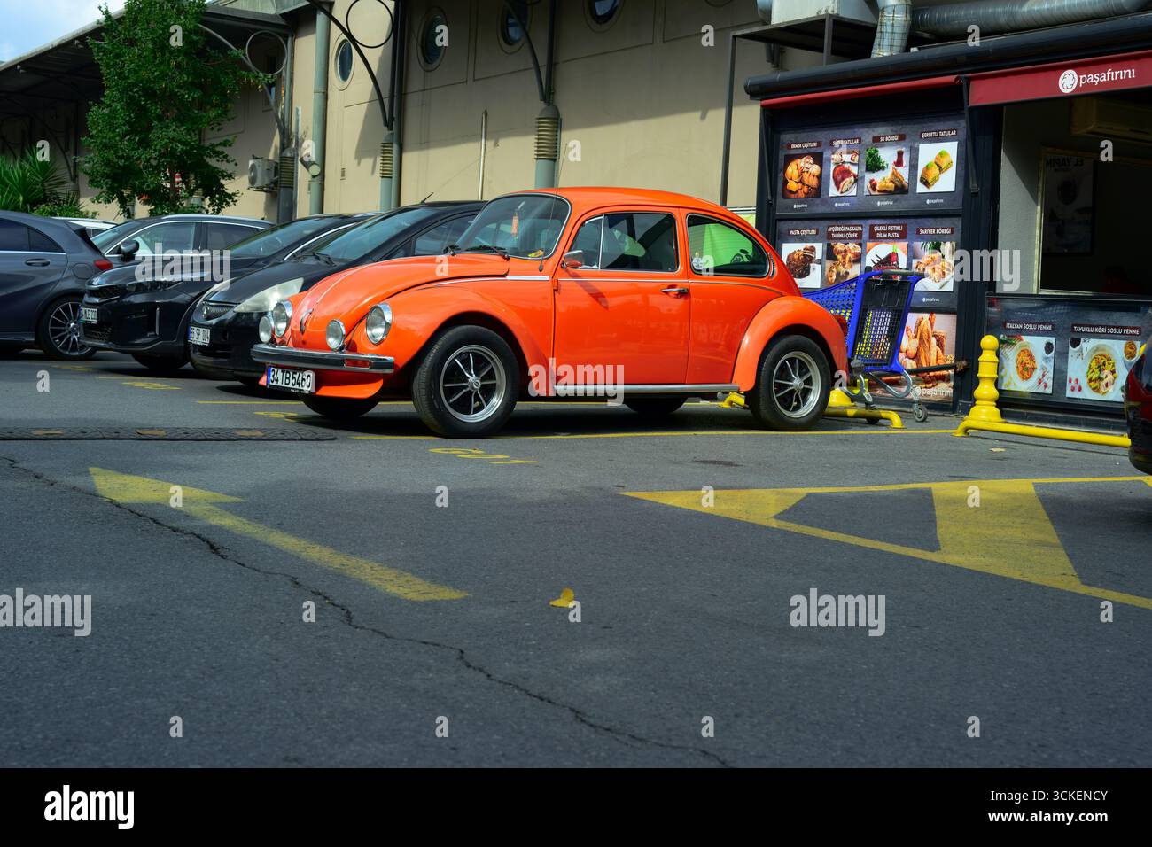 Vintage Orange Volkswagen Beetle Car Parked Outdoors vintage volkswagen ...