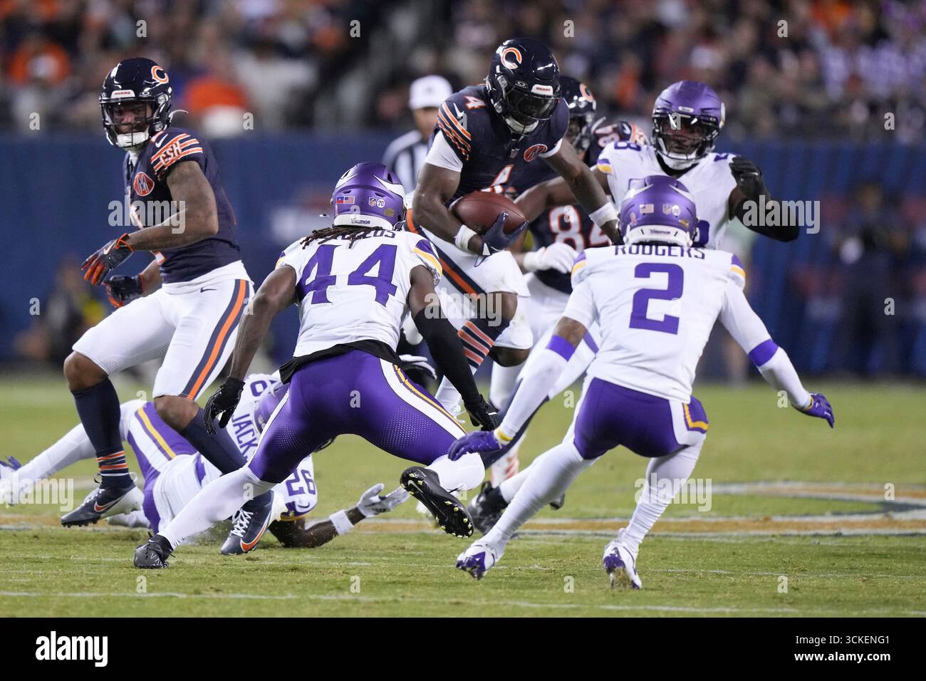Chicago Bears running back D'Andre Swift (4) jump as he runs away from Minnesota Vikings safety ...