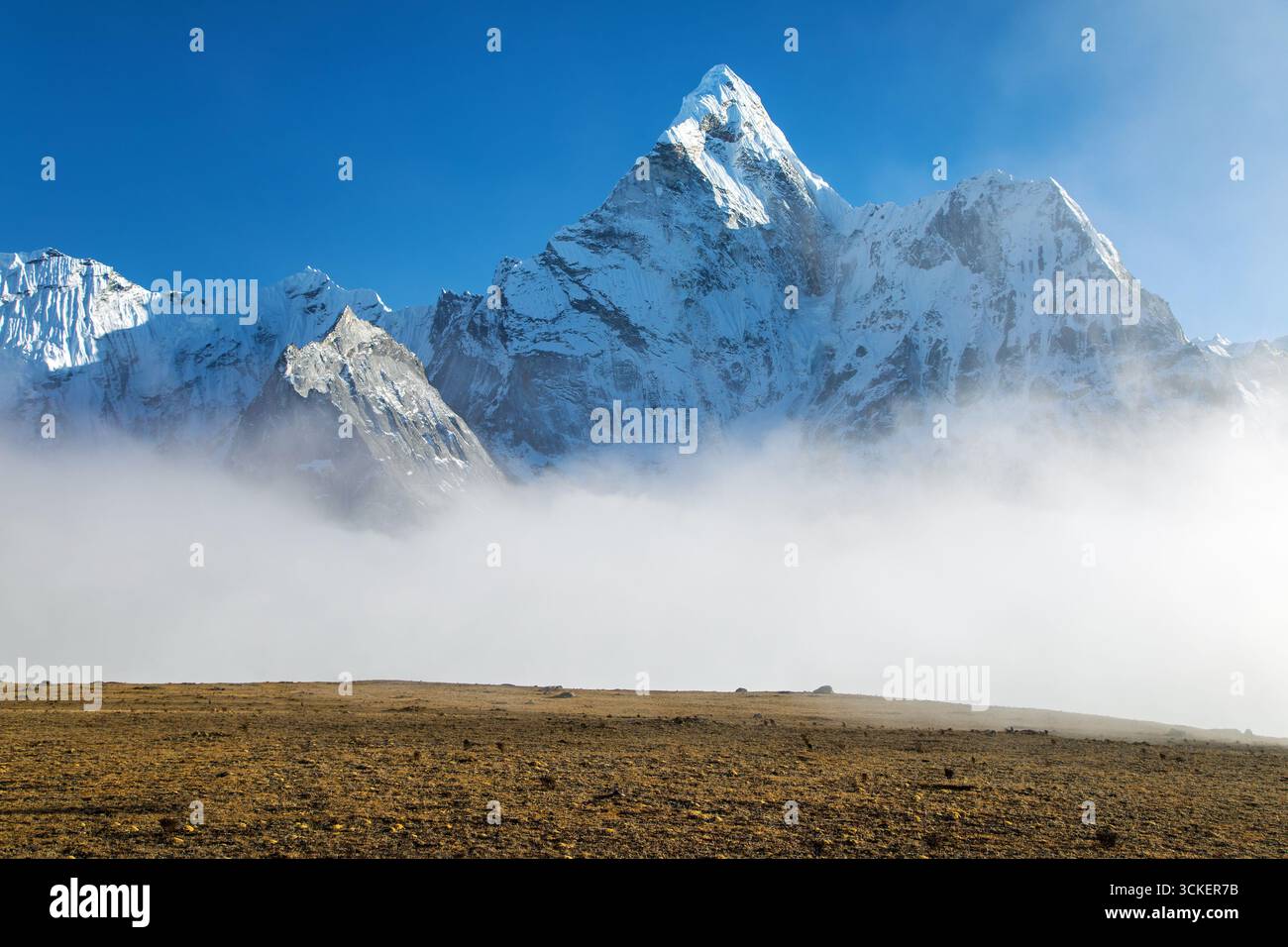 Mount Ama Dablam within cloud and blue sky, way to Mt Everest base camp ...