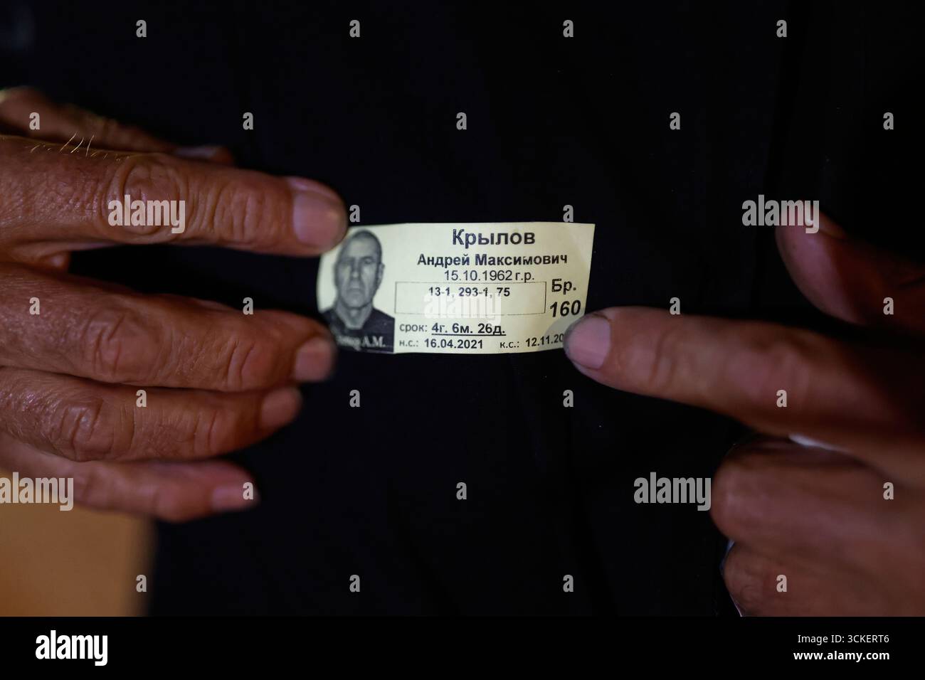 Andrei Krylov, one of released Belarusian prisoners shows his prison name tag to journalists as ...