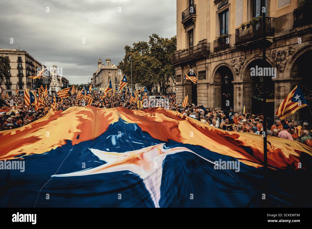 Barcelona, Spain. 11 September, 2025: Activists carry a giant Catalan ...