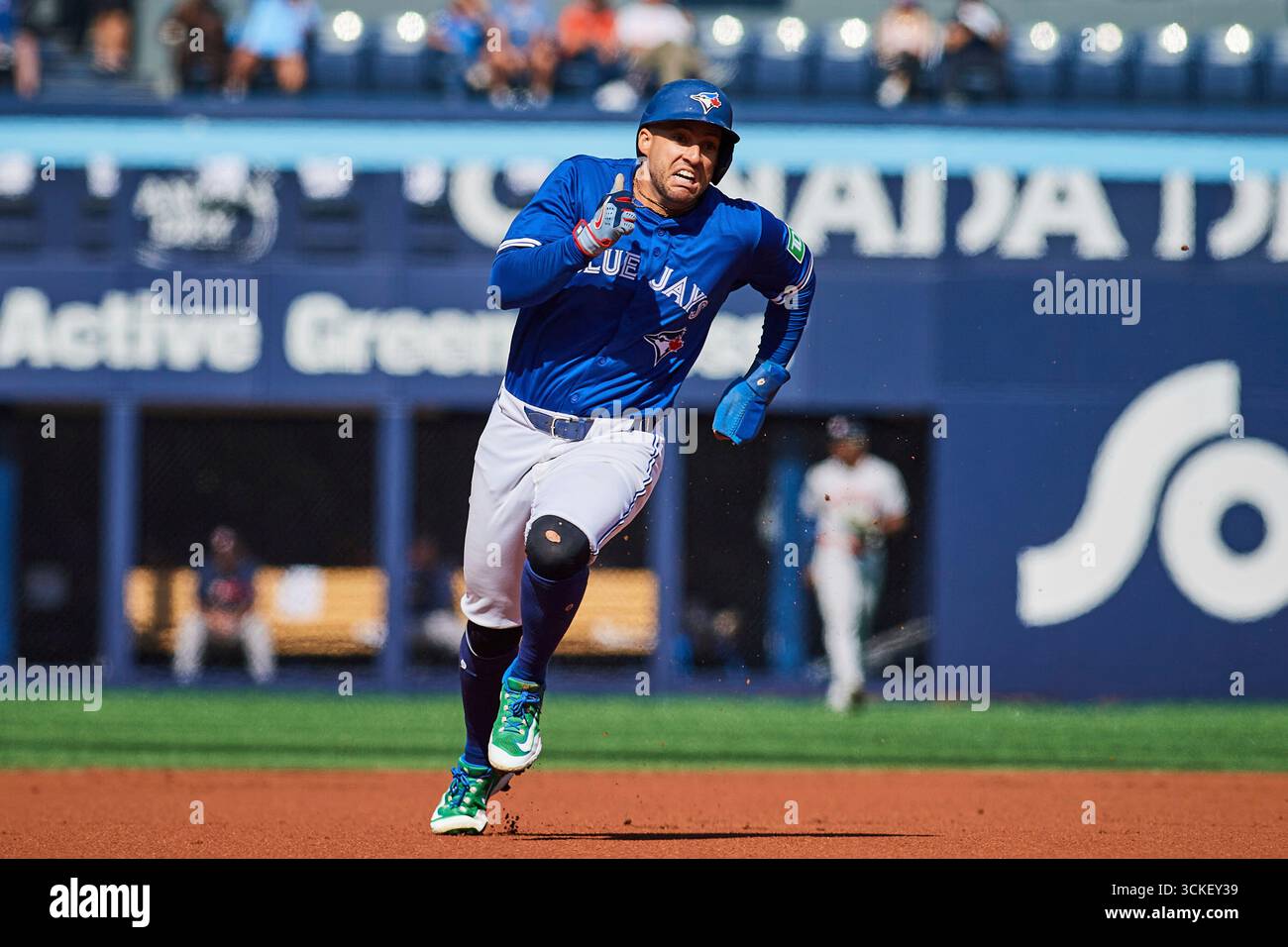 Toronto Blue Jays' George Springer (4) sprints to third as he scores ...