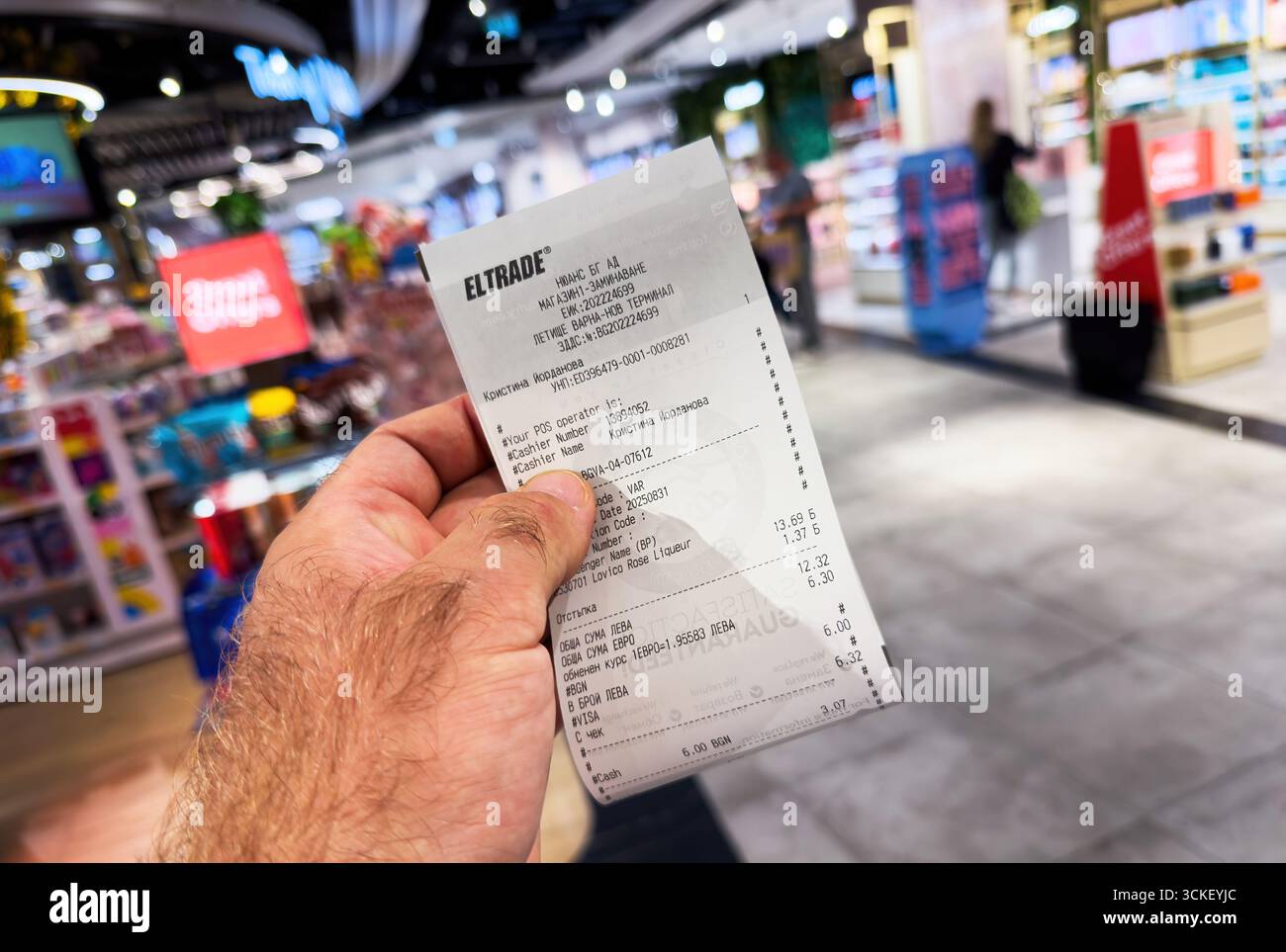 Varna, Bulgaria - Aug 31, 2025: Close-up of a shopper holding a receipt ...