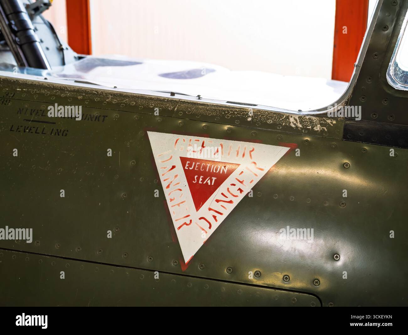 Close up of a military plane cockpit exterior showing a triangular ...