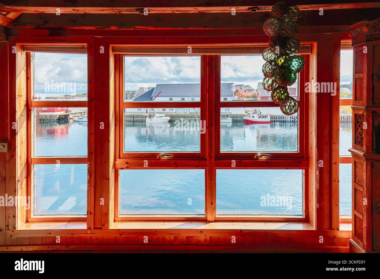 Fjord view through wooden windows showcasing tranquil waters and ...