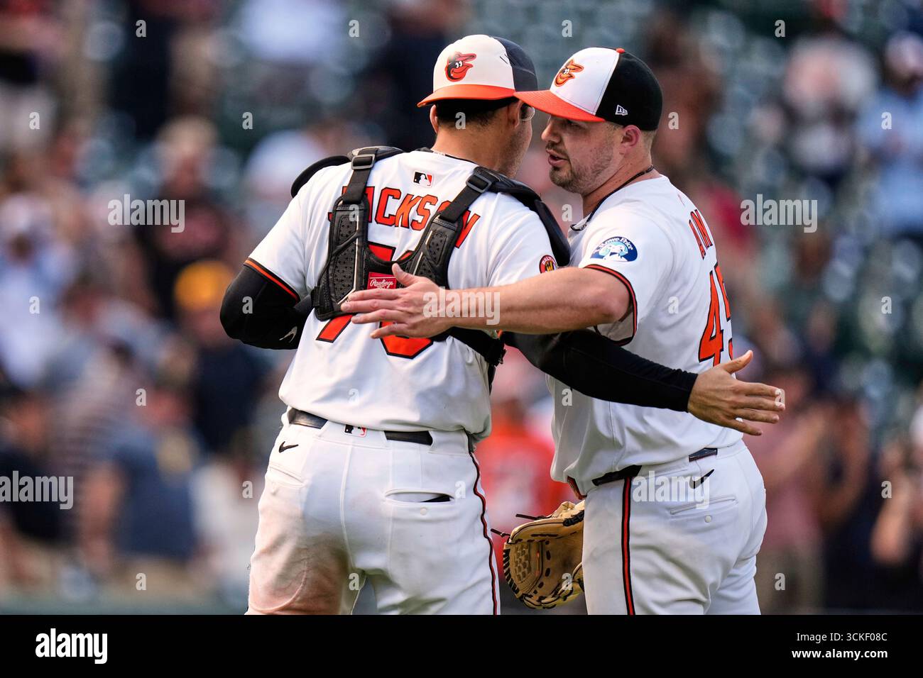 Baltimore Orioles catcher Alex Jackson, left, and relief pitcher Keegan ...