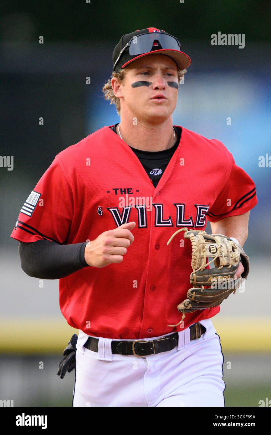 Shortstop Zach Daudet (26) of the Fayetteville Woodpeckers returns to the dugout during a ...
