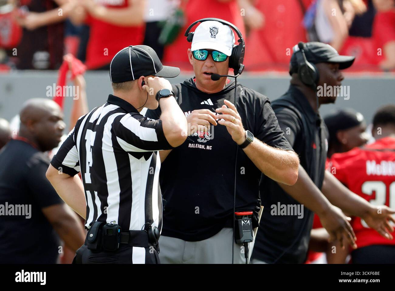 North Carolina State head coach Dave Doeren talks with an official ...
