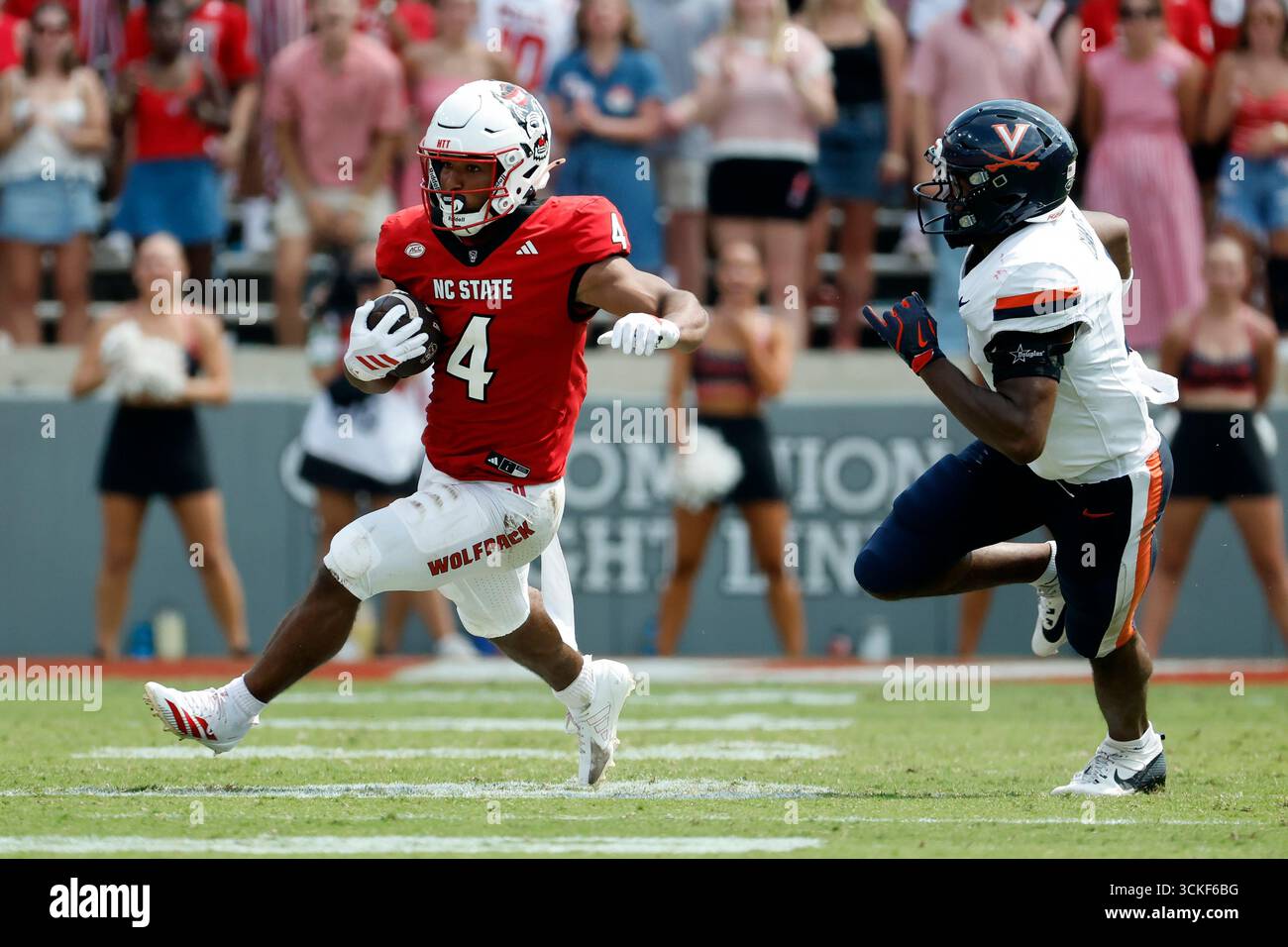 North Carolina State running back Jayden Scott (4) carries the ball ...