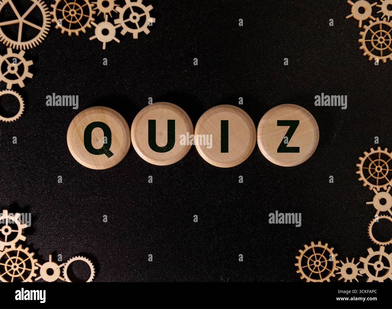 four wooden cubes with the text 'QUIZ' conveys a sense of knowledge ...