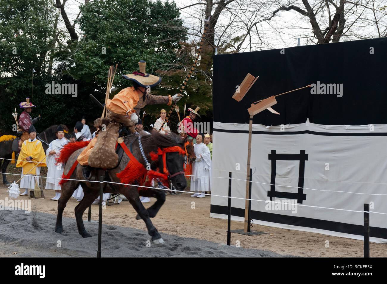 Japanese archers on horseback shooting arrows at a wooden target during ...
