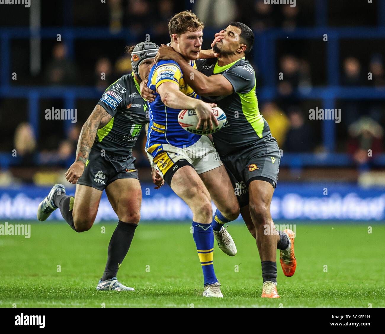 Morgan Gannon of Leeds Rhinos is tackled during the Betfred Super ...