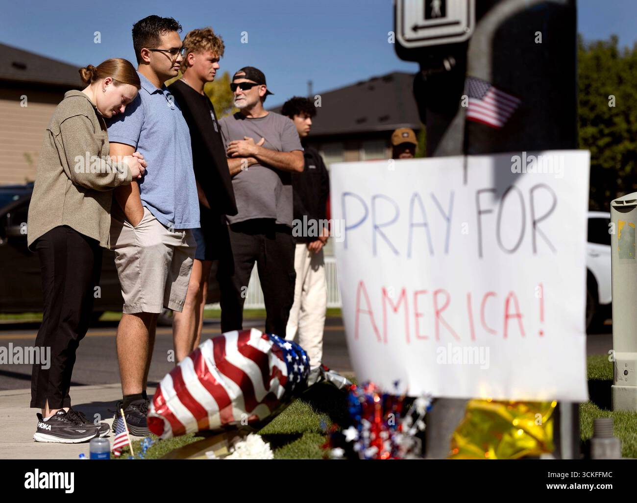 People visit a memorial honoring Charlie Kirk at Timpanogos Regional ...