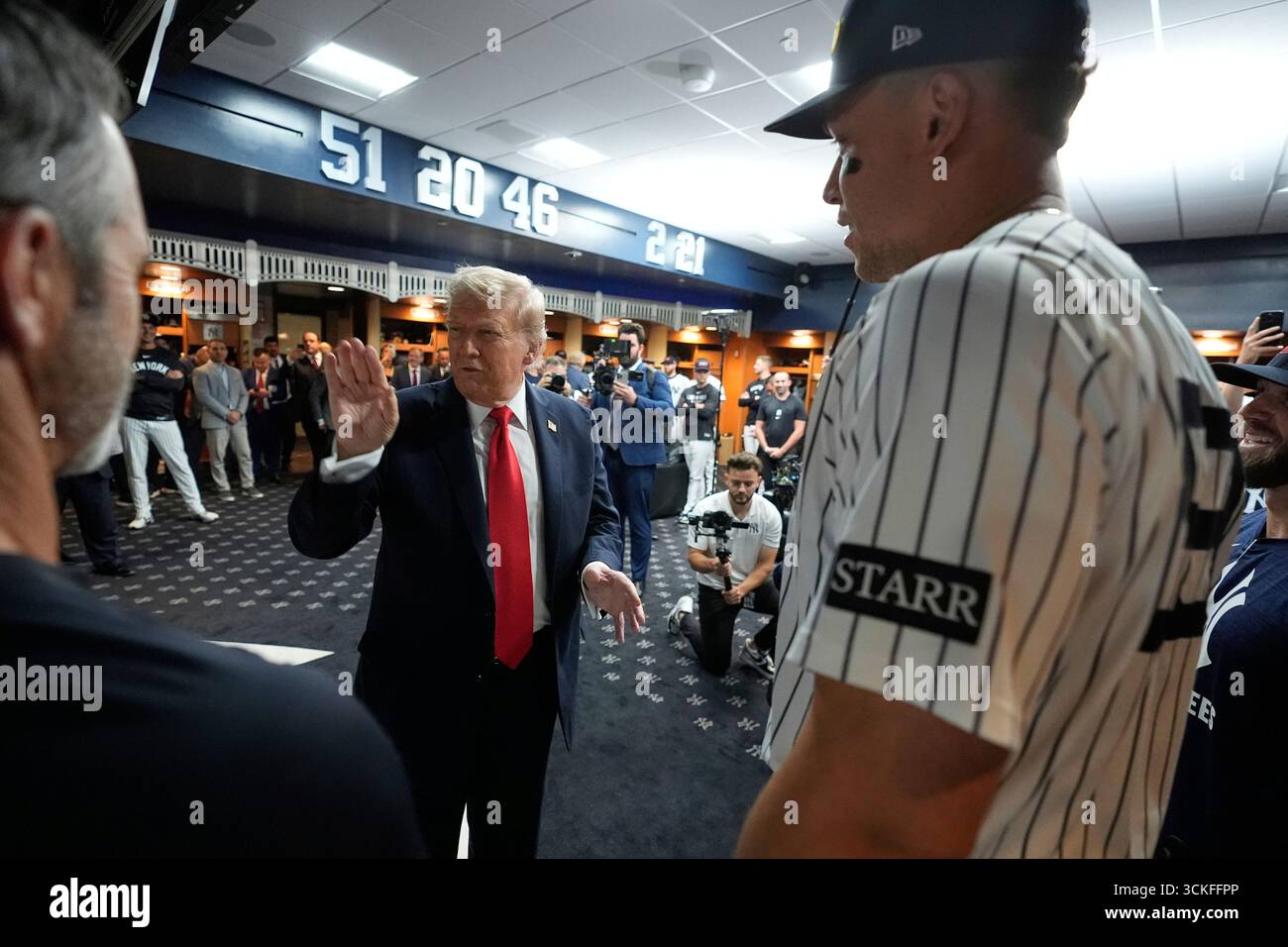 President Donald Trump talks to players including New York Yankees ...