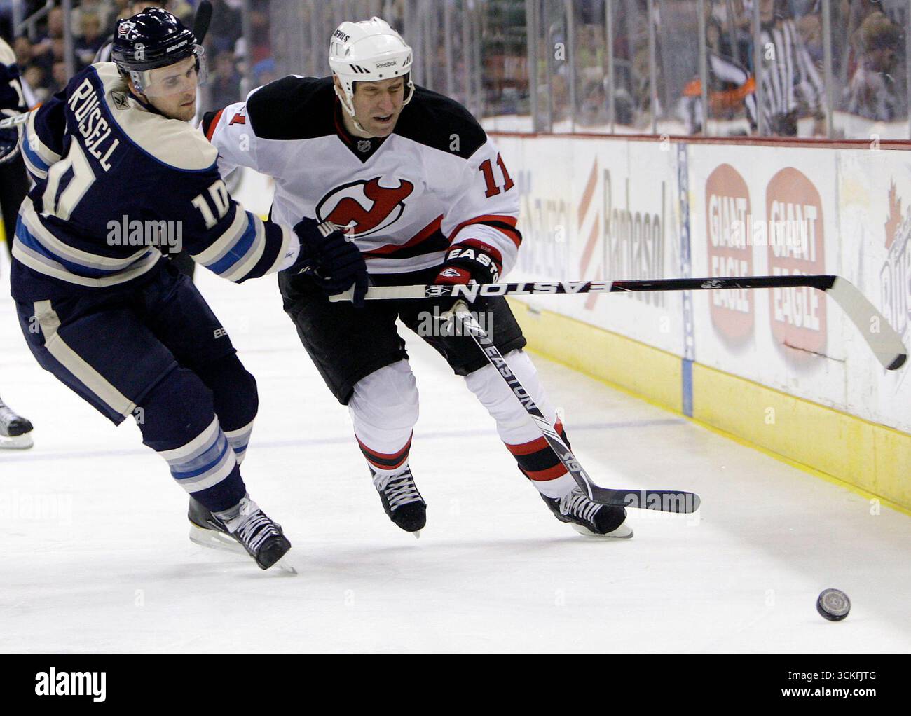 FILE - New Jersey Devils' Adam Mair, right, and Columbus Blue Jackets ...
