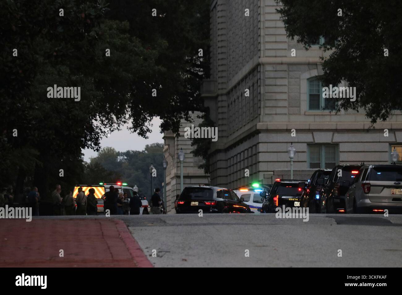 Law enforcement officers gather on the grounds of the U.S. Naval ...