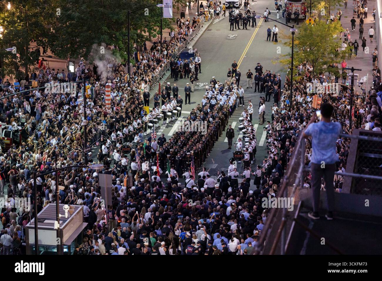 People take part in the annual Sunset Ceremony, to remember the 343 ...