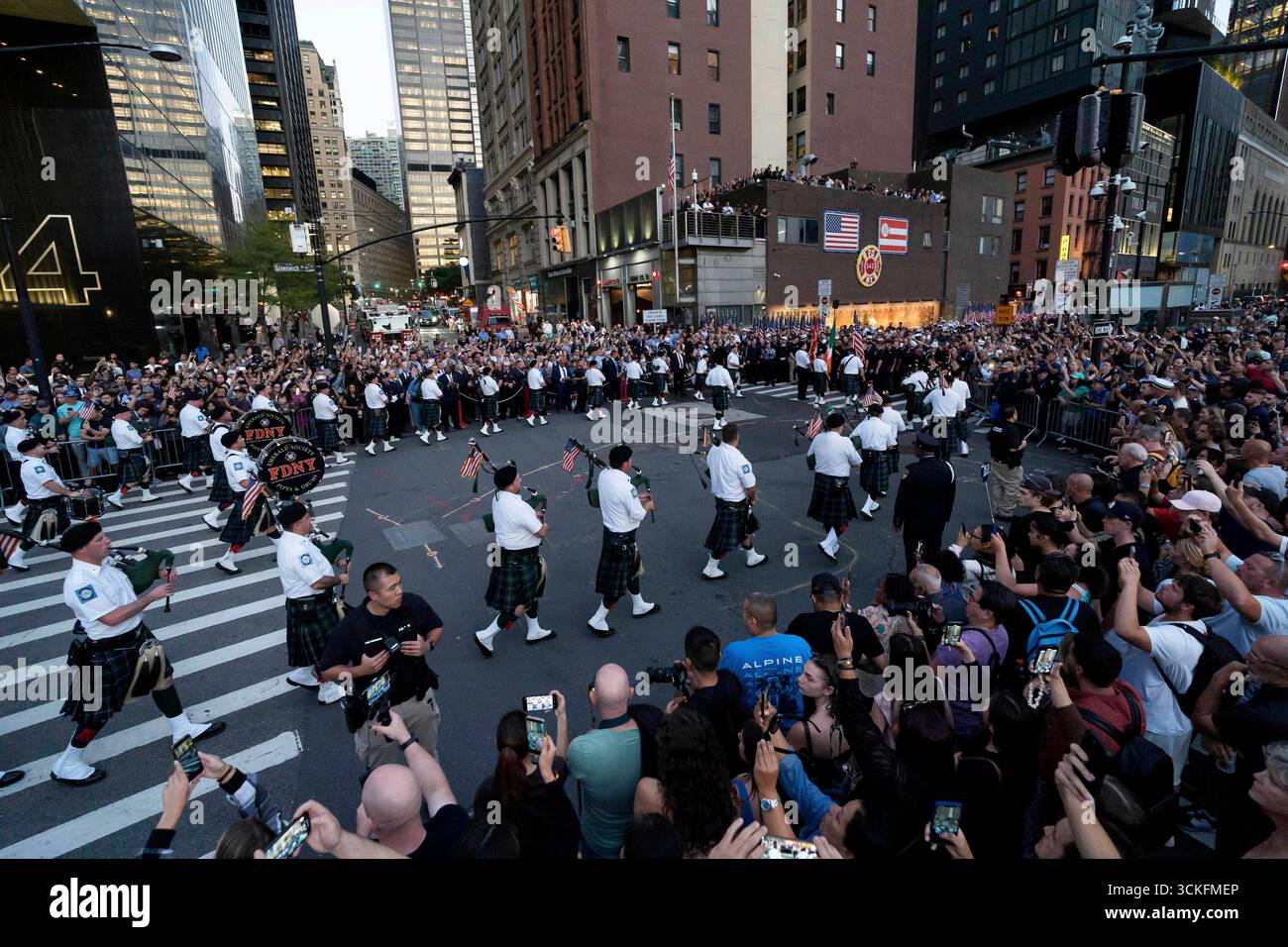 People take part in the annual Sunset Ceremony, to remember the 343 ...