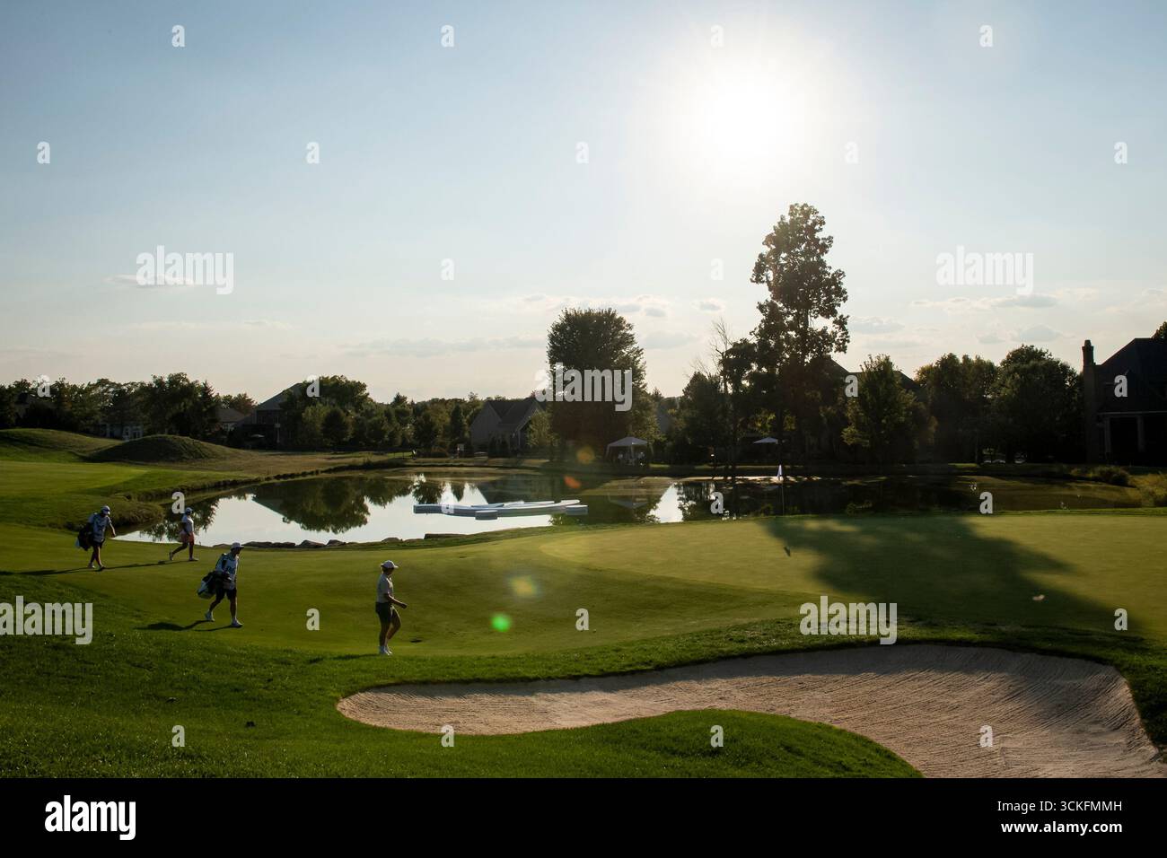 Gigi Stoll and Kristen Gillman approach the green on the 17th hole ...