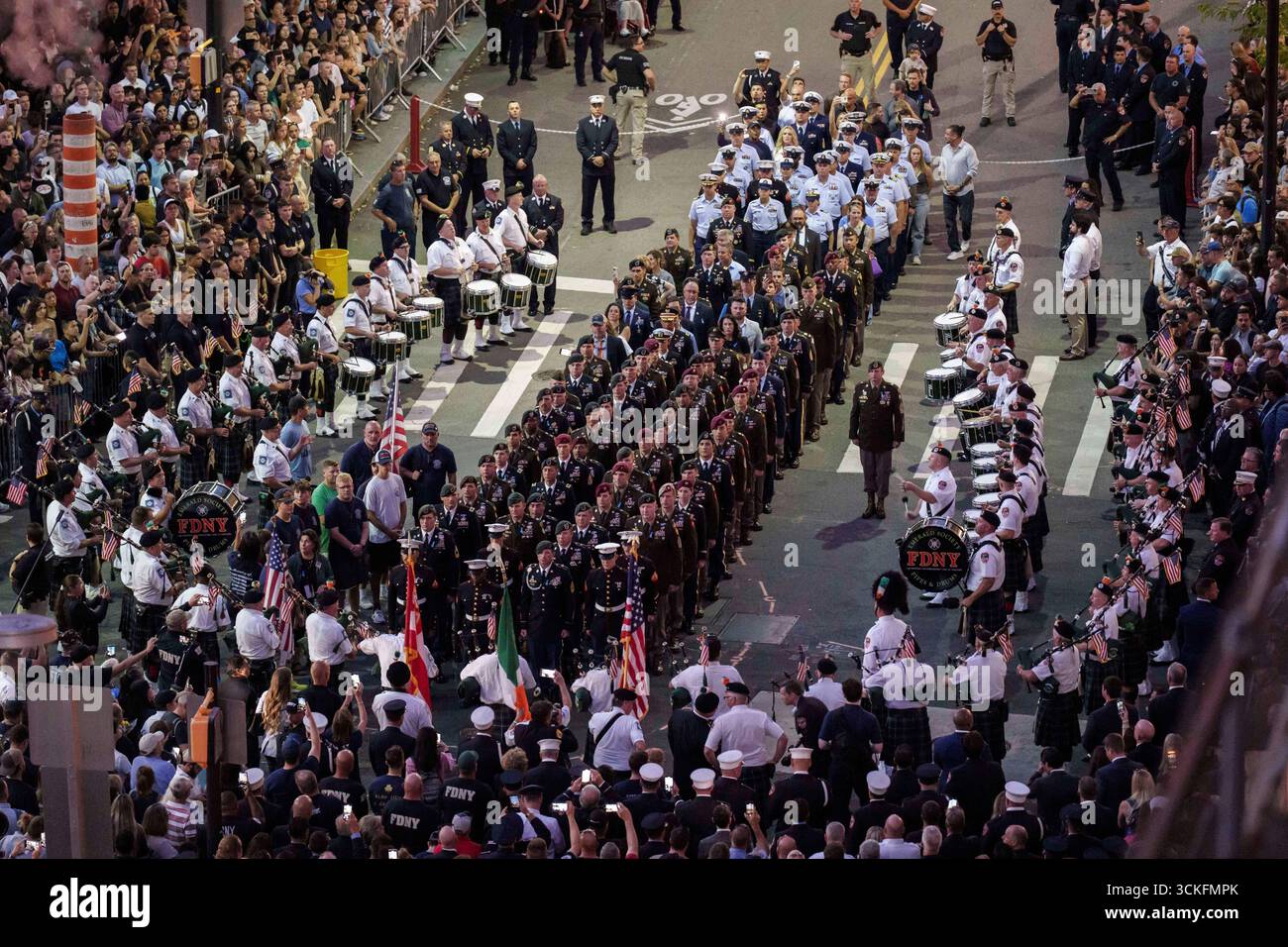 People take part in the annual Sunset Ceremony, to remember the 343 ...