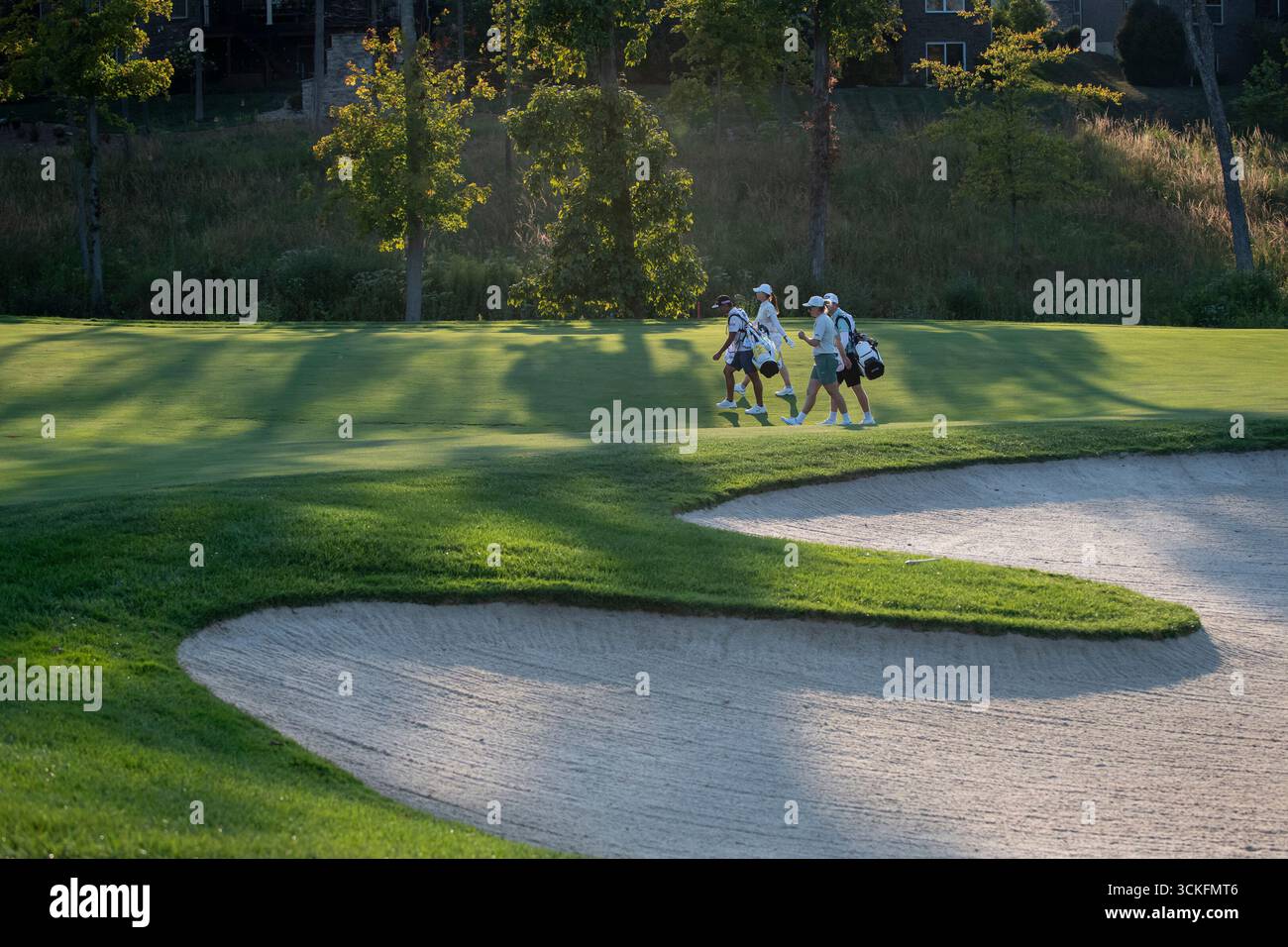 Gigi Stoll walks with Hinako Shibuno, of Japan, towards the 18th green ...