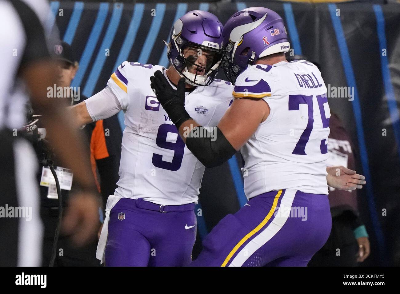 Minnesota Vikings quarterback J.J. McCarthy, left, celebrates with ...