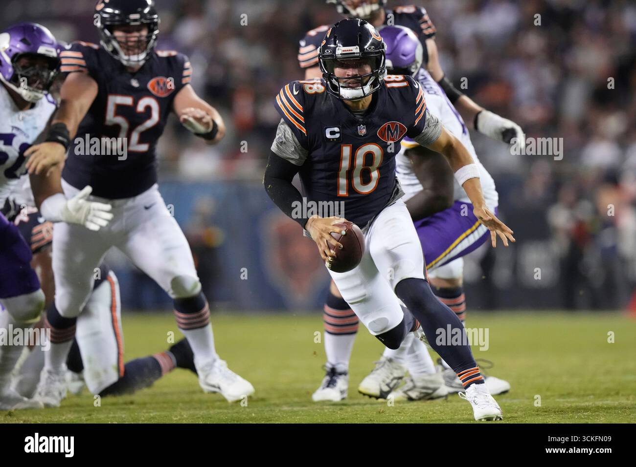 Chicago Bears quarterback Caleb Williams (18) runs with a ball during ...