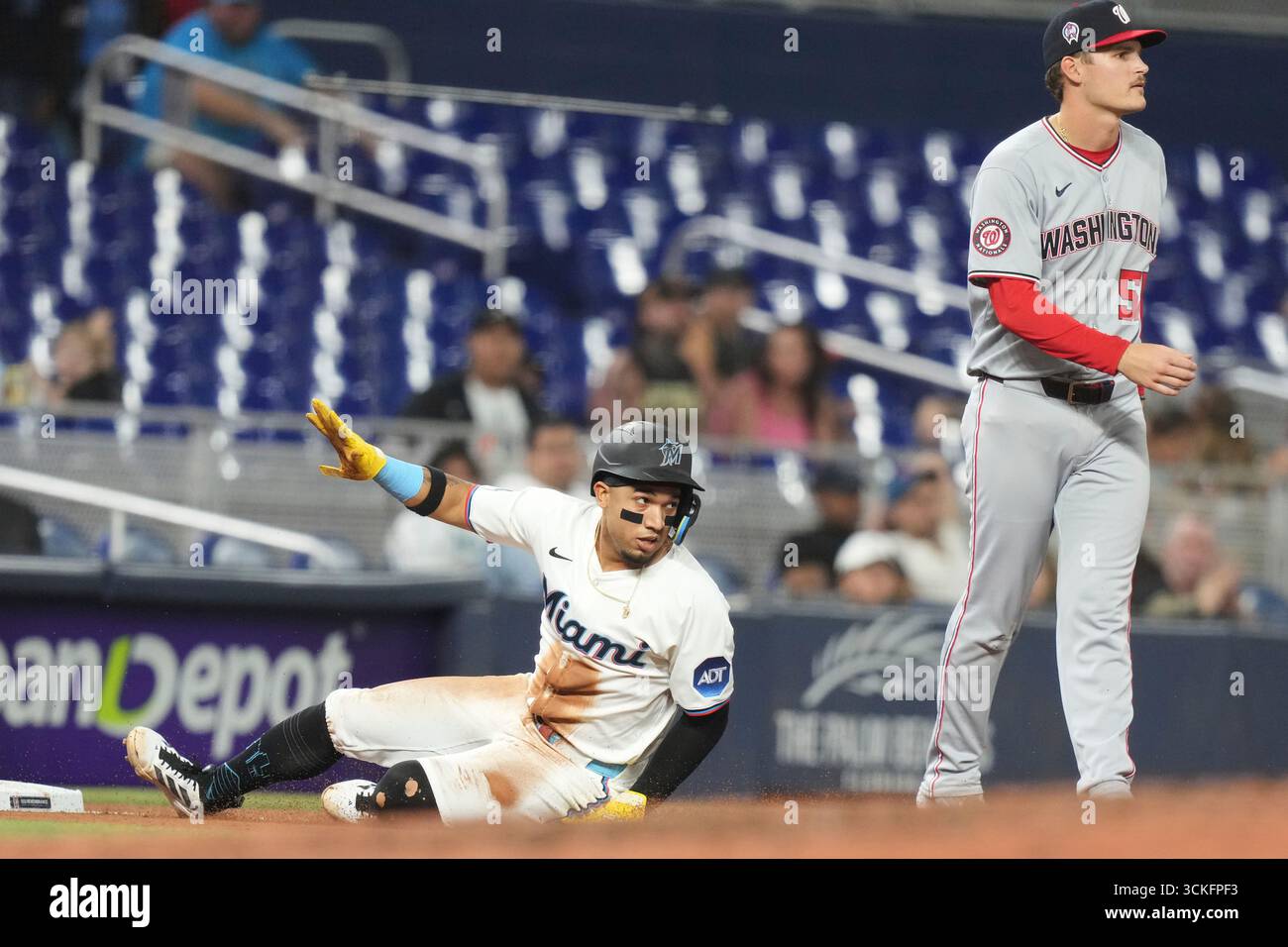 Miami Marlins' Maximo Acosta, left steals third past Washington ...