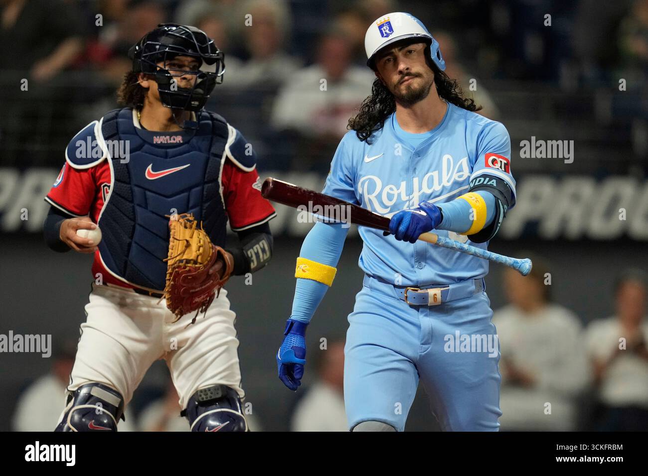 Kansas City Royals' Jonathan India walks back to the dugout in front of ...