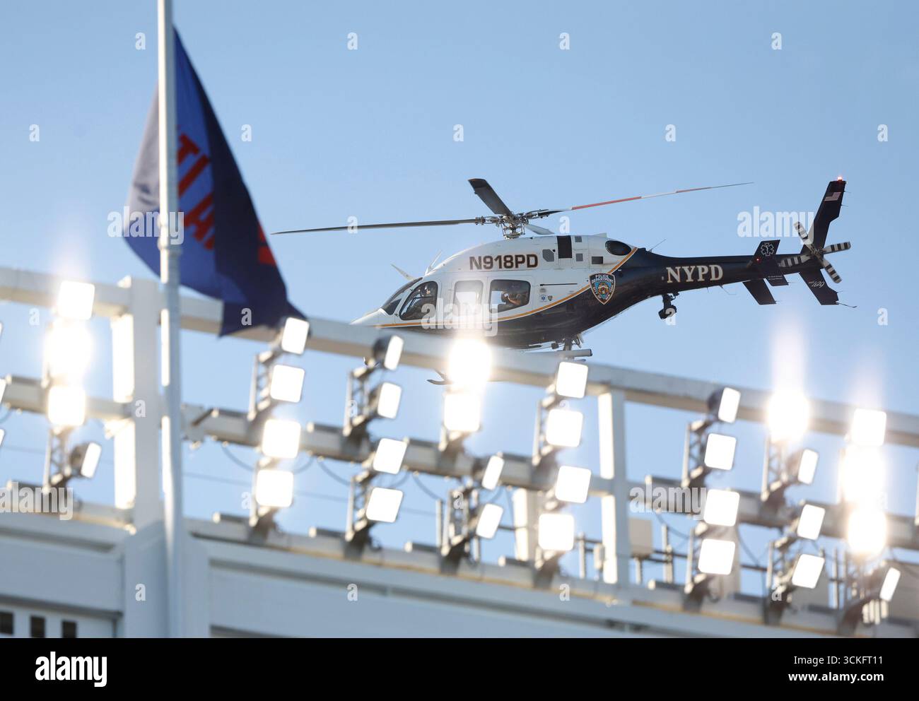 An NYPD helicopter flies over Yankee Stadium before US President Donald ...
