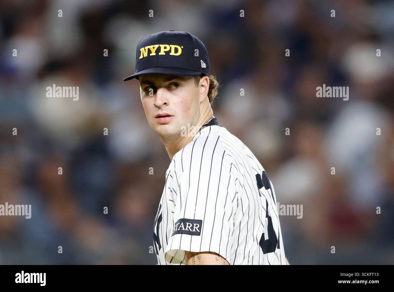 New York Yankees starting pitcher Cam Schlittler wears an NYPD hat when ...