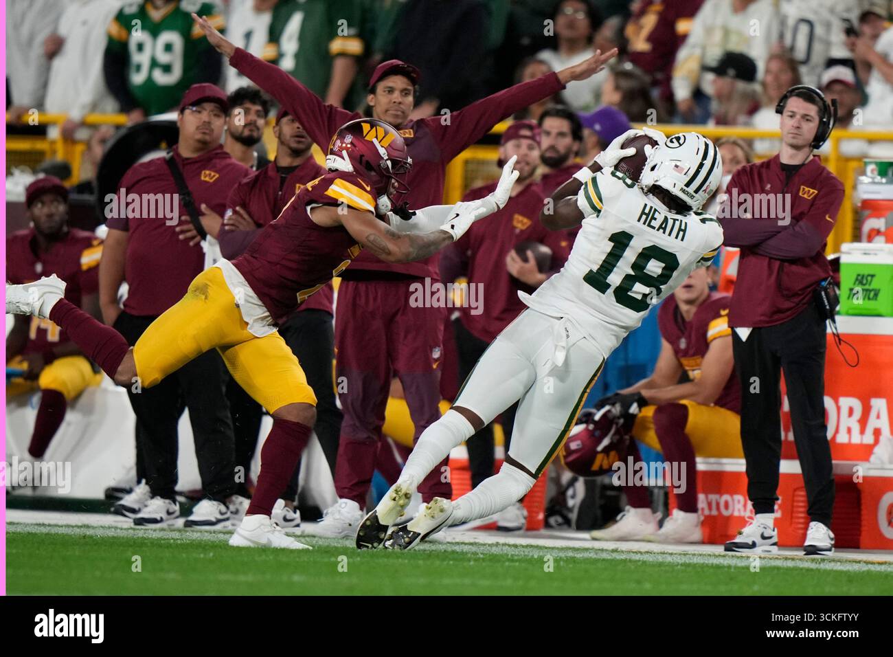 Green Bay Packers wide receiver Malik Heath (18) stays inbounds to ...