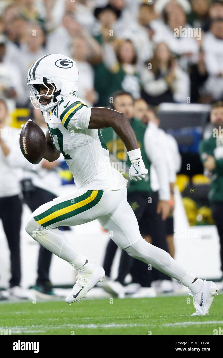 Green Bay Packers wide receiver Romeo Doubs (87) runs after the catch ...