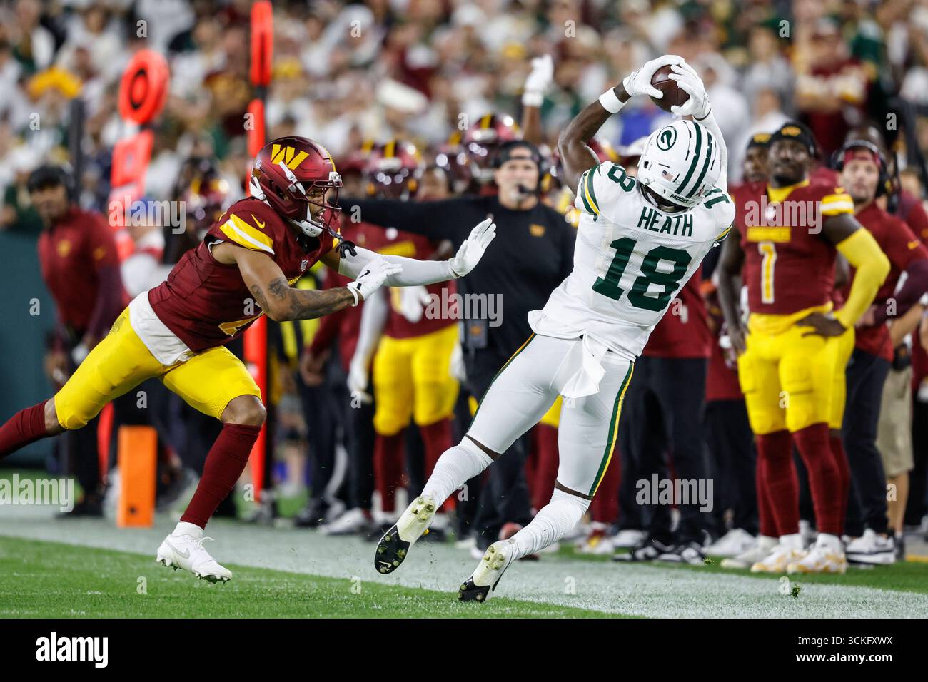 Green Bay Packers wide receiver Malik Heath (18) makes a sideline catch ...