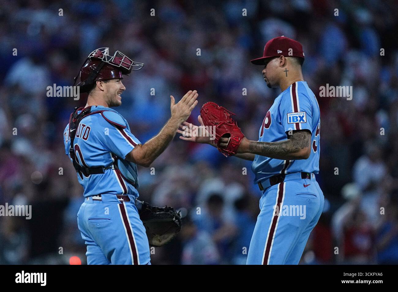 Philadelphia Phillies catcher J.T. Realmuto, left, and pitcher Jhoan ...