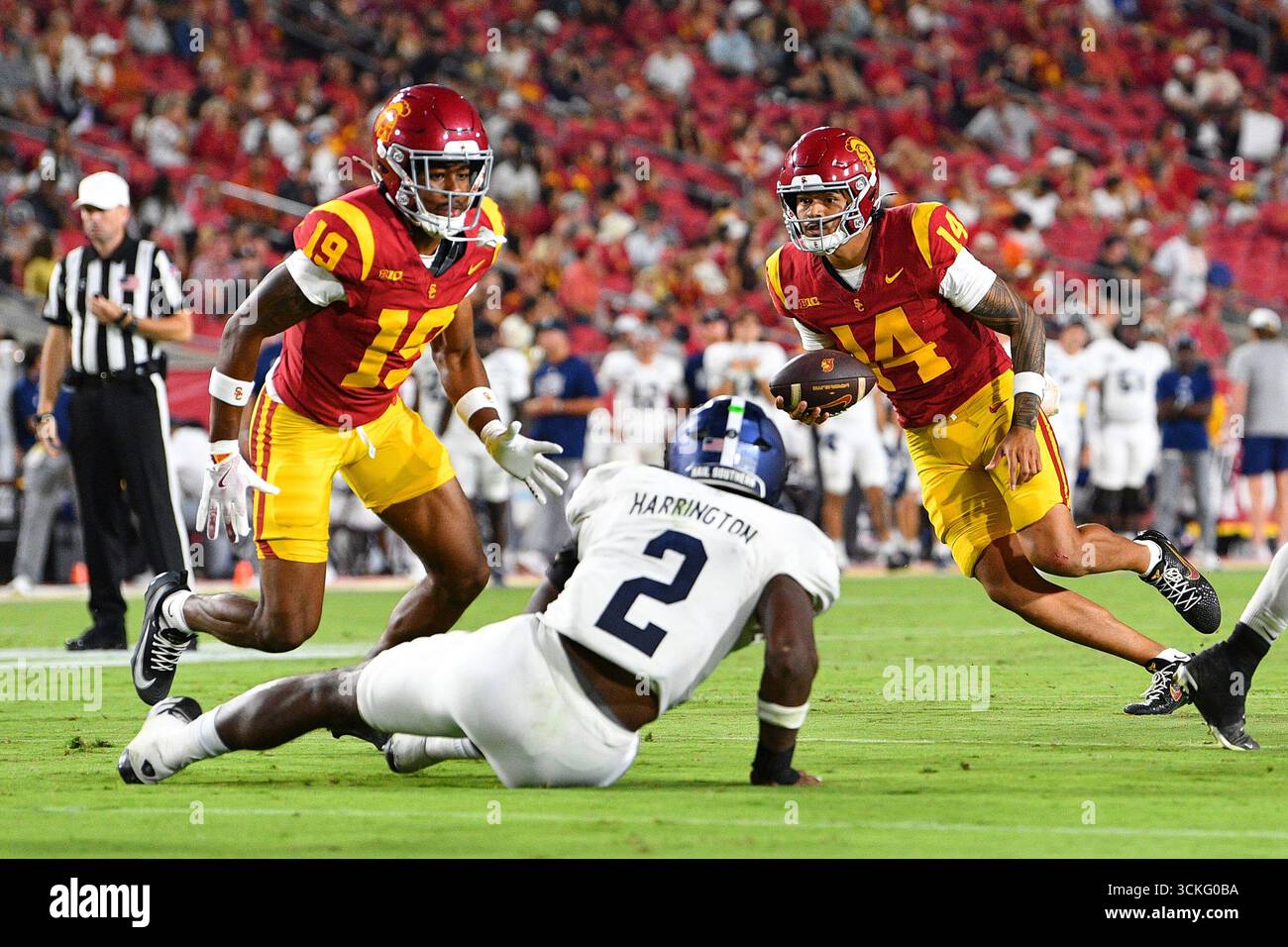 LOS ANGELES, CA - SEPTEMBER 06: USC Trojans quarterback Jayden Maiava (14) tries to avoid a ...