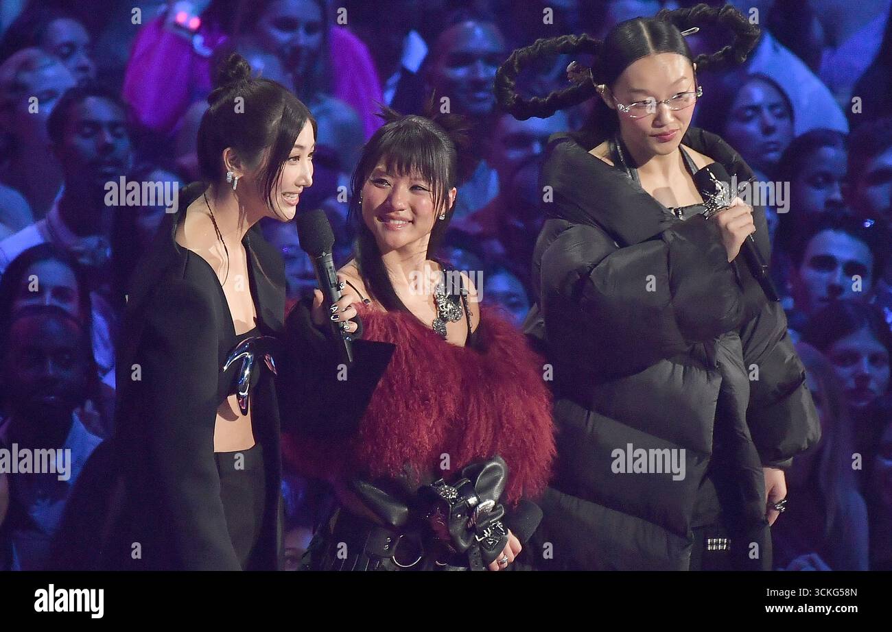 EJAE, Rei Ami, and Audrey Nuna of HUNTR/X onstage during the 2025 MTV ...