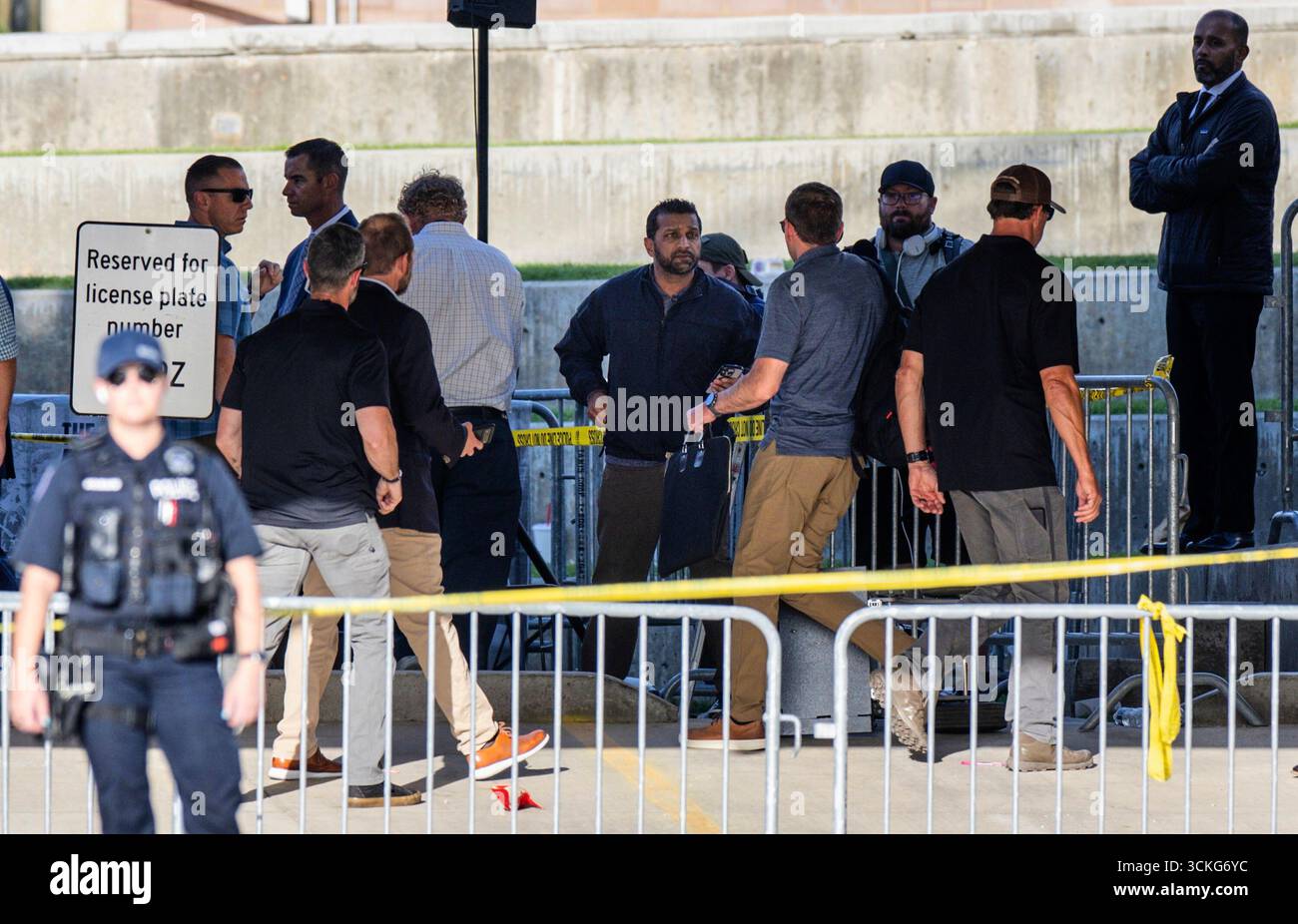 FBI Director Kash Patel, center, arrives at the scene of the shooting ...