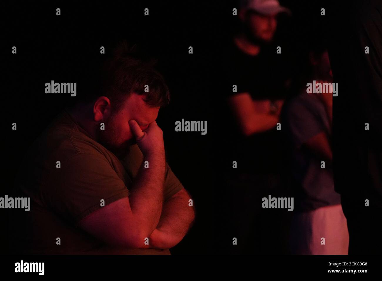 Aaron Tharp of Orem, Utah, reacts during a vigil for Charlie Kirk, the ...