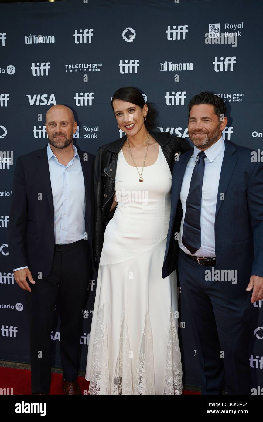(L-R) Chris Lemole, Margot Hand and Tim Zajaros attend the red carpet ...