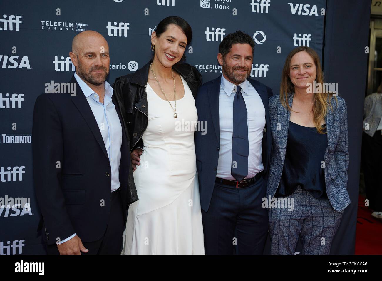 (L-R) Chris Lemole, Margot Hand and Tim Zajaros attend the red carpet ...