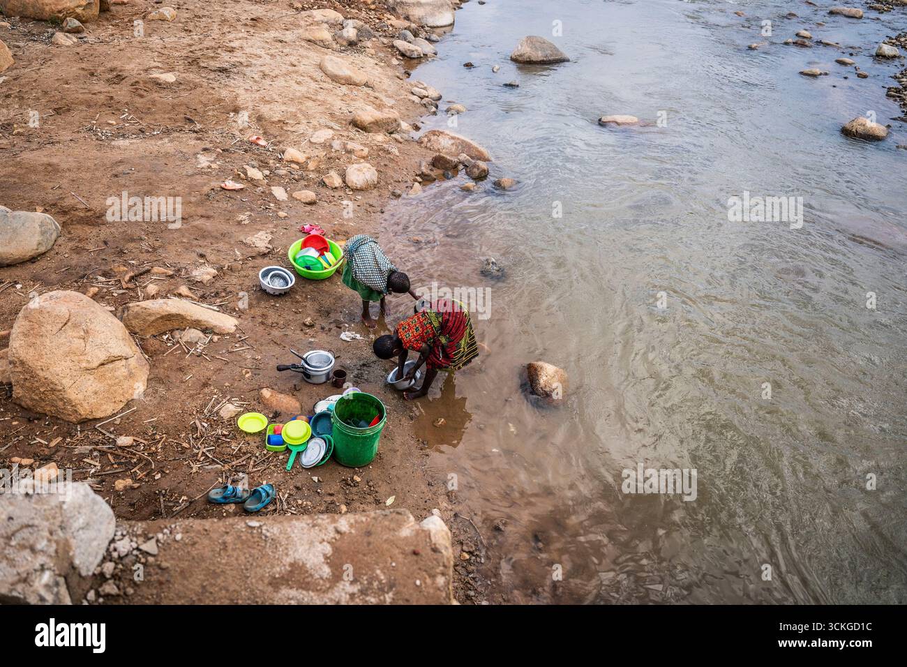 Children wash pots at a river in Mulanje, southern Malawi, Tuesday ...