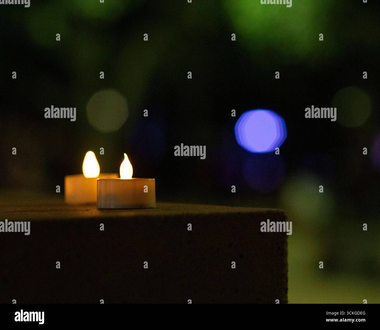 Electronic candles are dispersed prior to a vigil for Charlie Kirk at ...