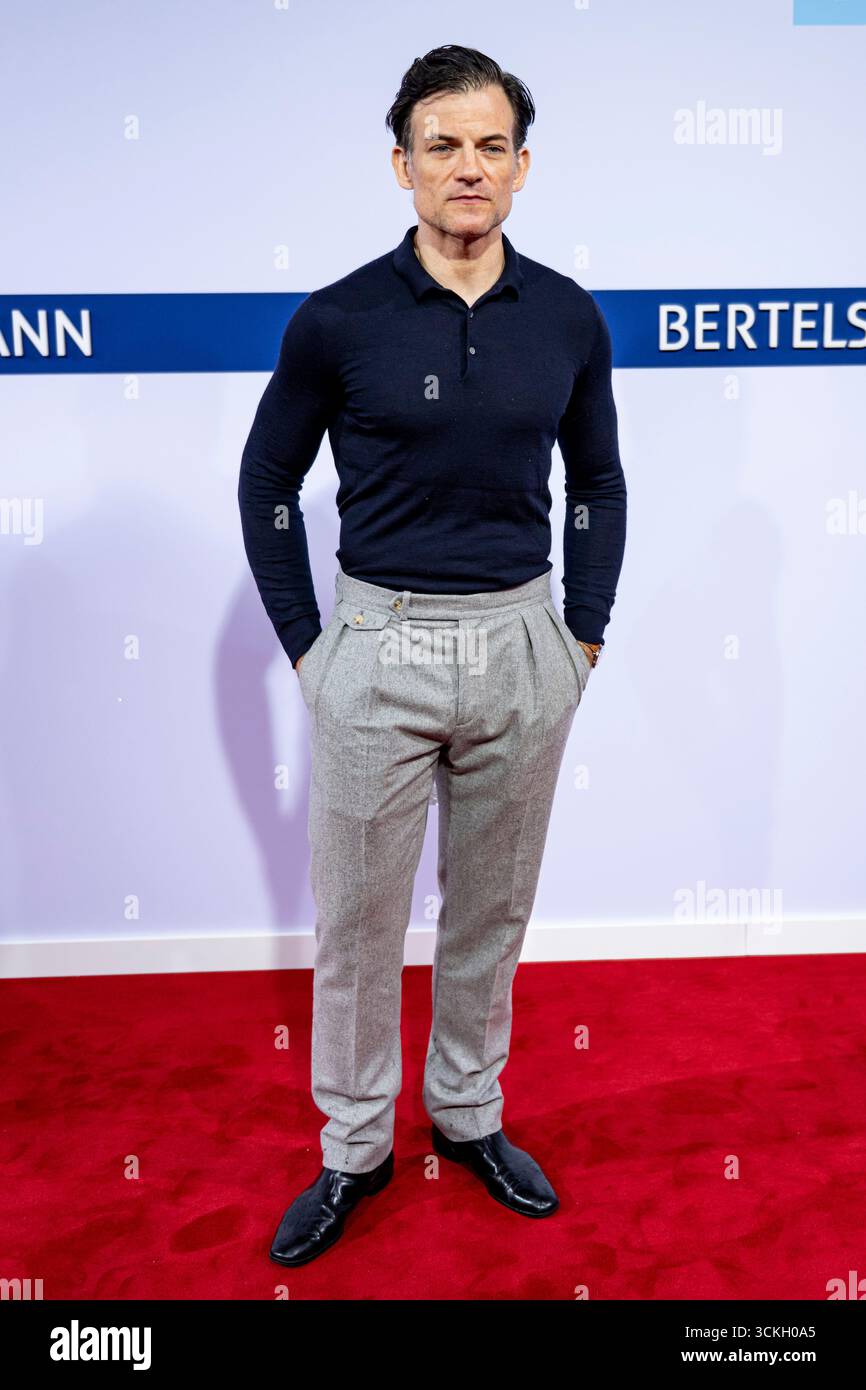 11 September 2025, Berlin: Actor Torben Liebrecht walks the red carpet ...