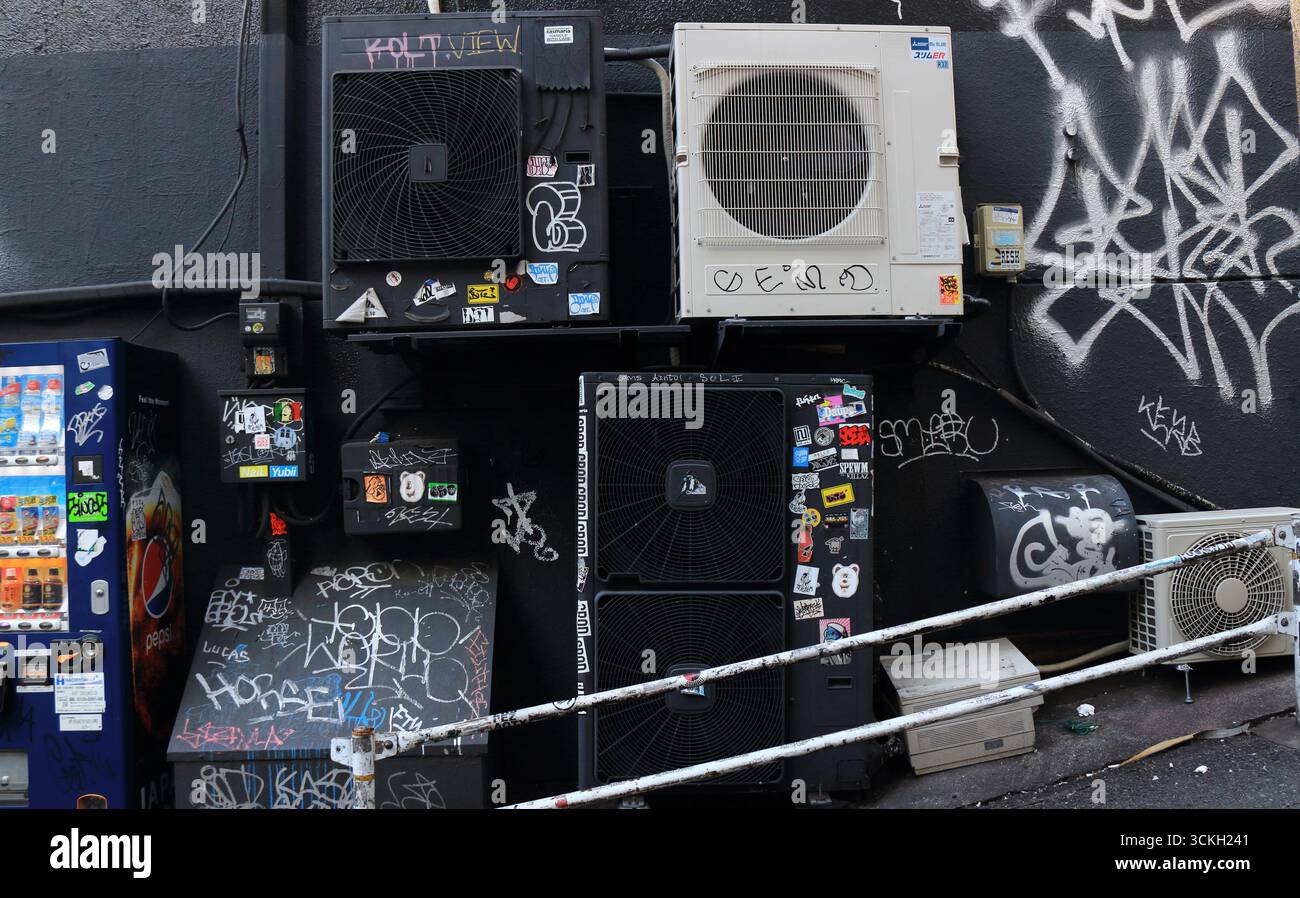 Tokyo Street View Condenser unit and graffiti in the back alley Stock ...